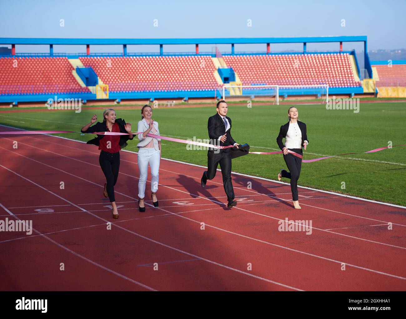 business people running together on athletics racing track Stock Photo ...