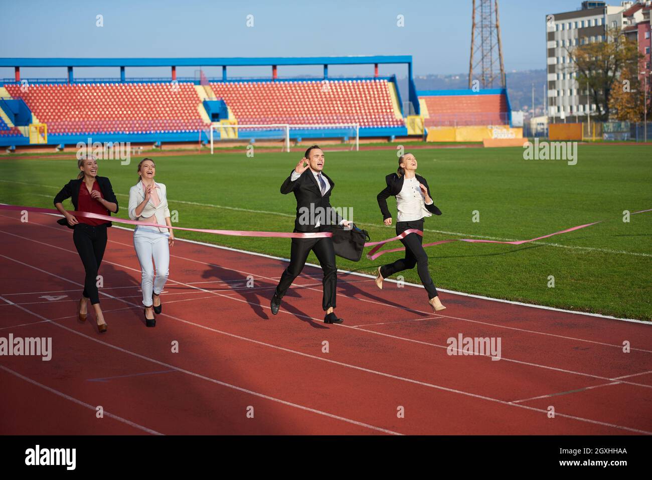 business people running together on racing track Stock Photo - Alamy