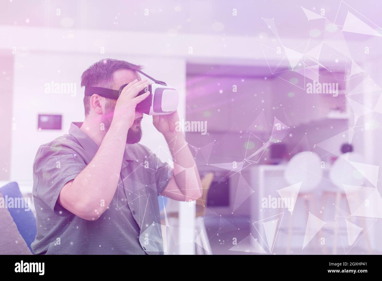 man trying virtual reality vr glasses at modern home with futuristic ...