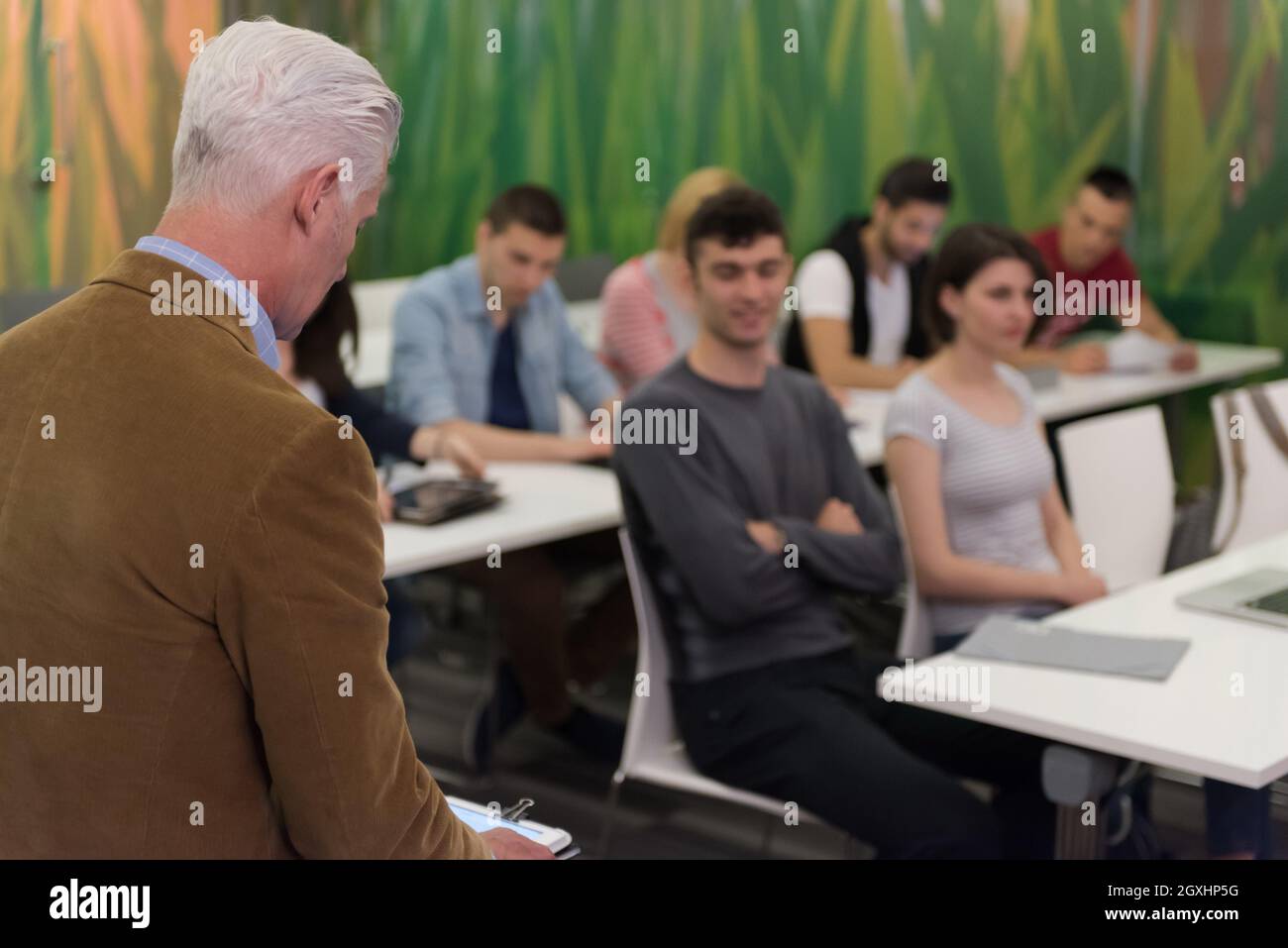 group of students study with professor in modern school classroom Stock ...