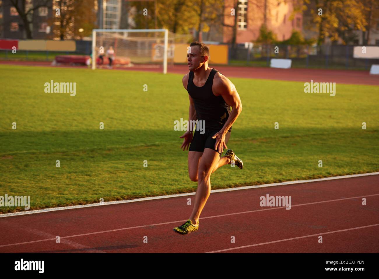 Sprinter leaving starting blocks on the running track. Explosive start ...