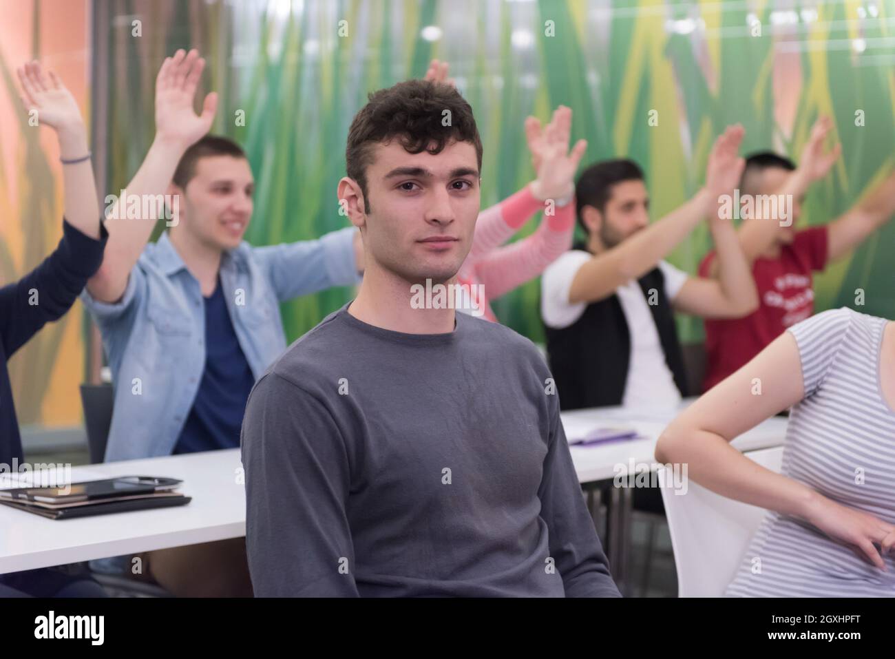 teacher teaching lessons, smart students group raise hands up in school ...