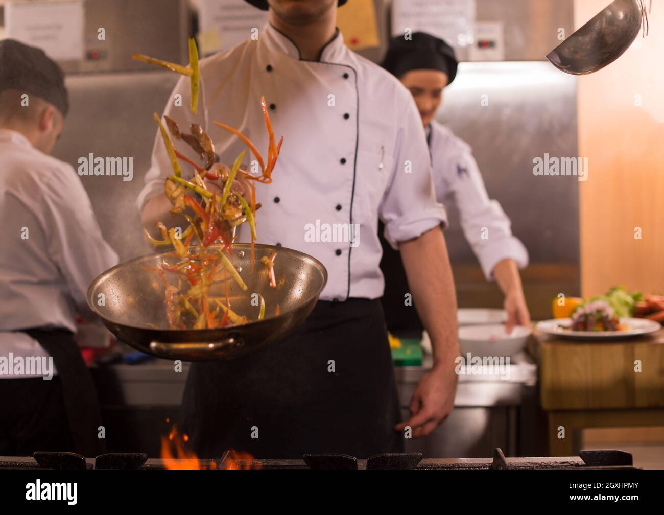 Flipping food in pan hi-res stock photography and images - Alamy