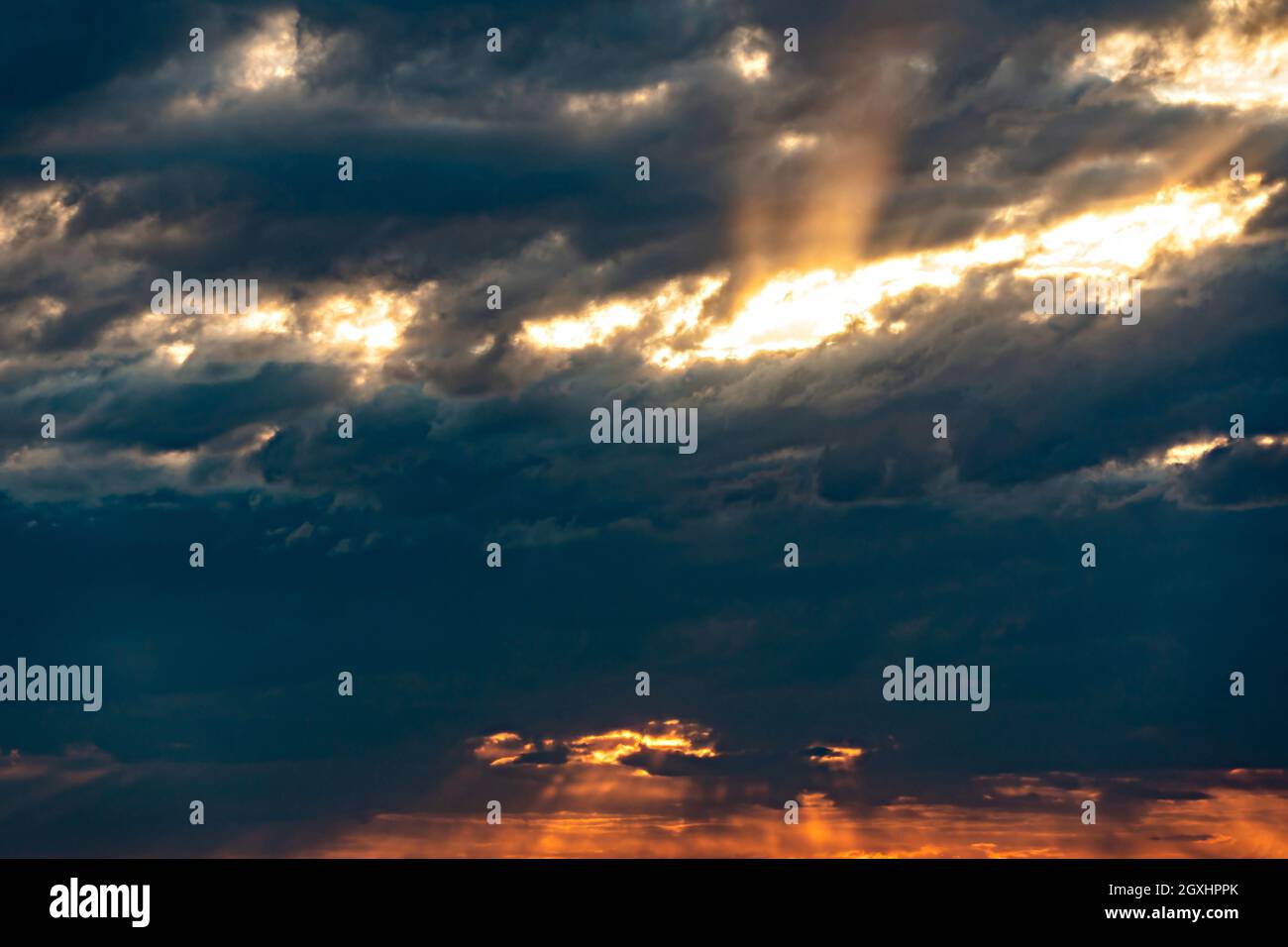The heavenly light of the sun.Dramatic evening sky with clouds and rays ...