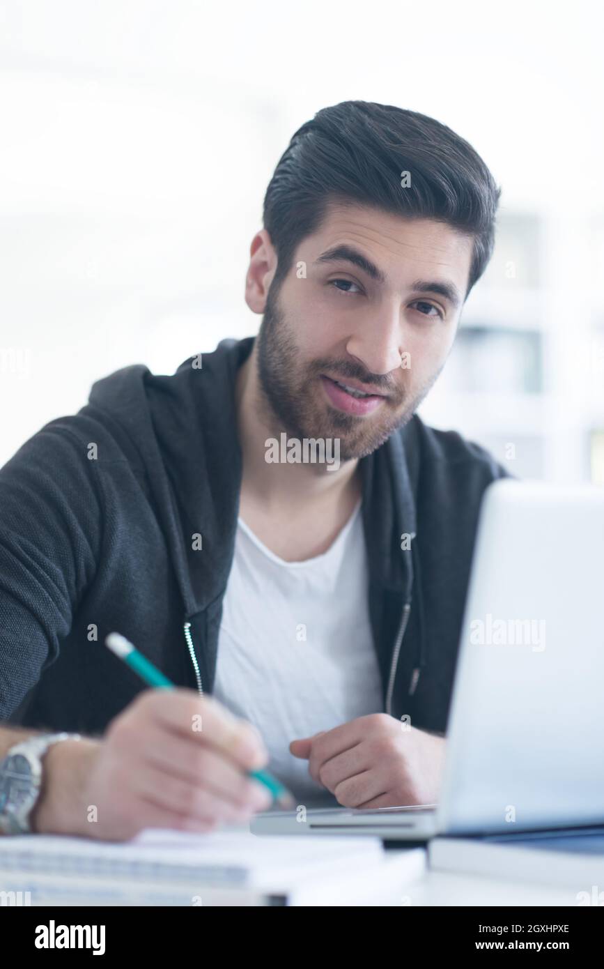 student preparing exam and learning lessons in school library, making ...