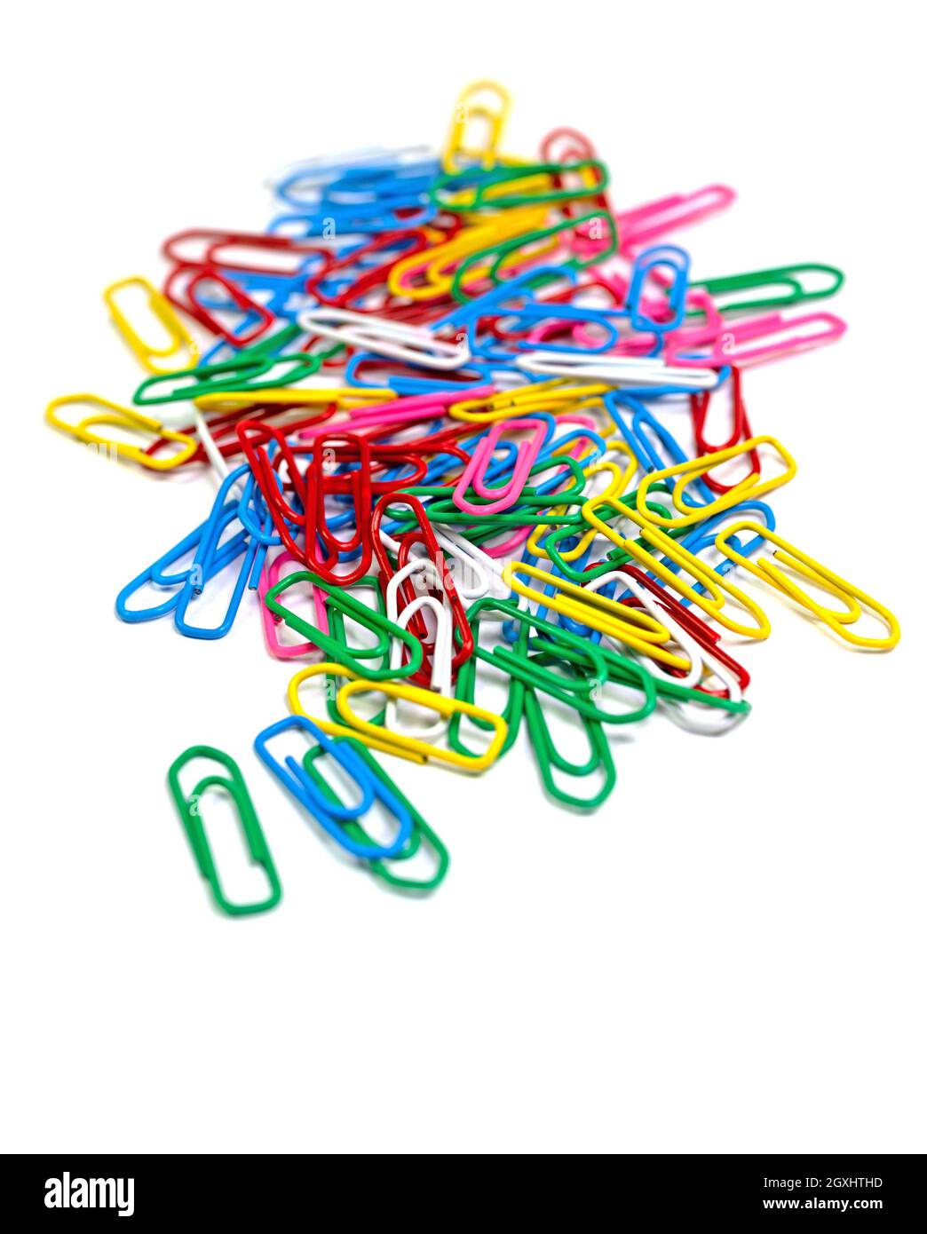 Lots of colorful paper clips against a white background Stock Photo - Alamy