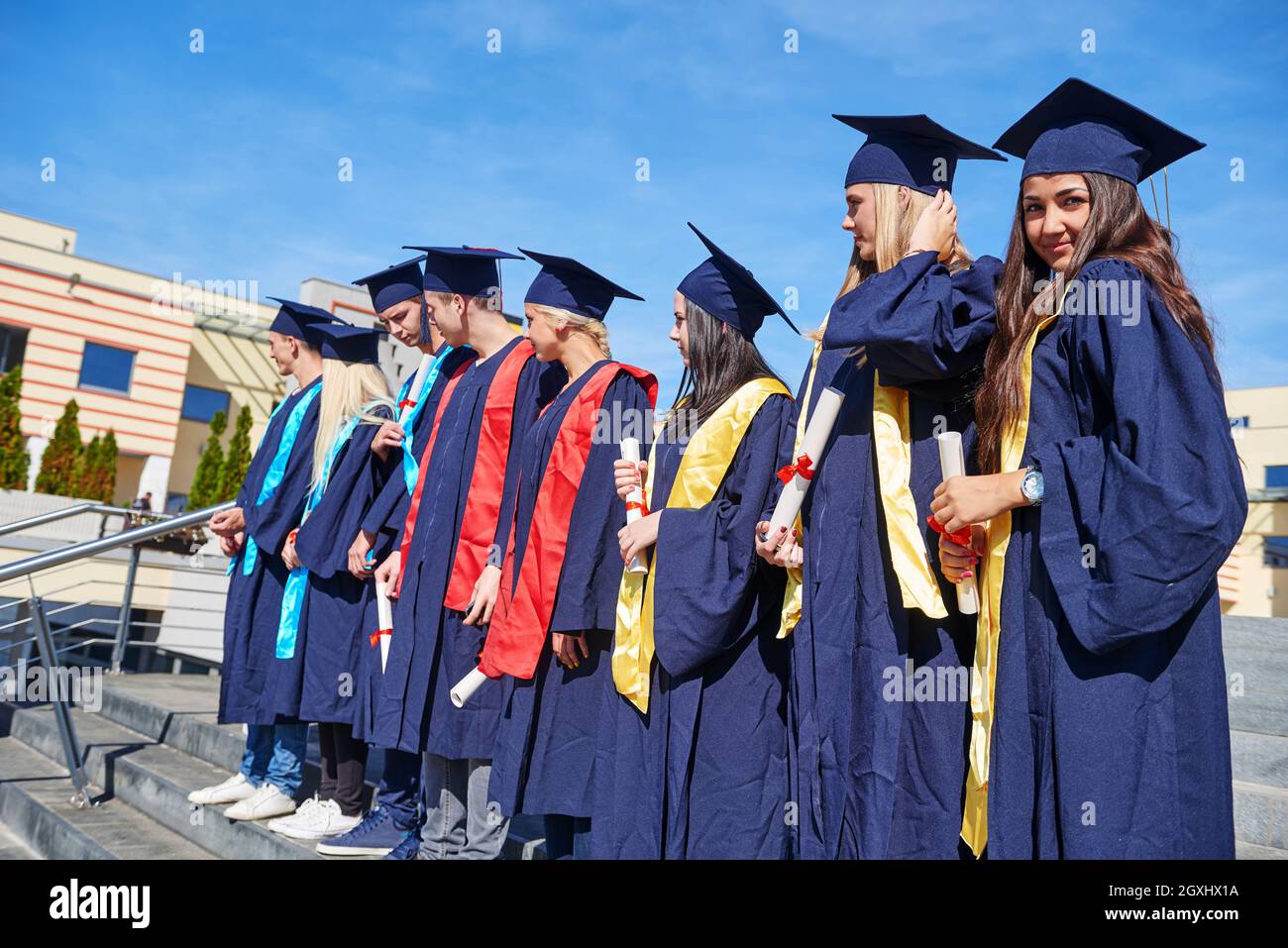 young graduates students group standing in front of university building ...