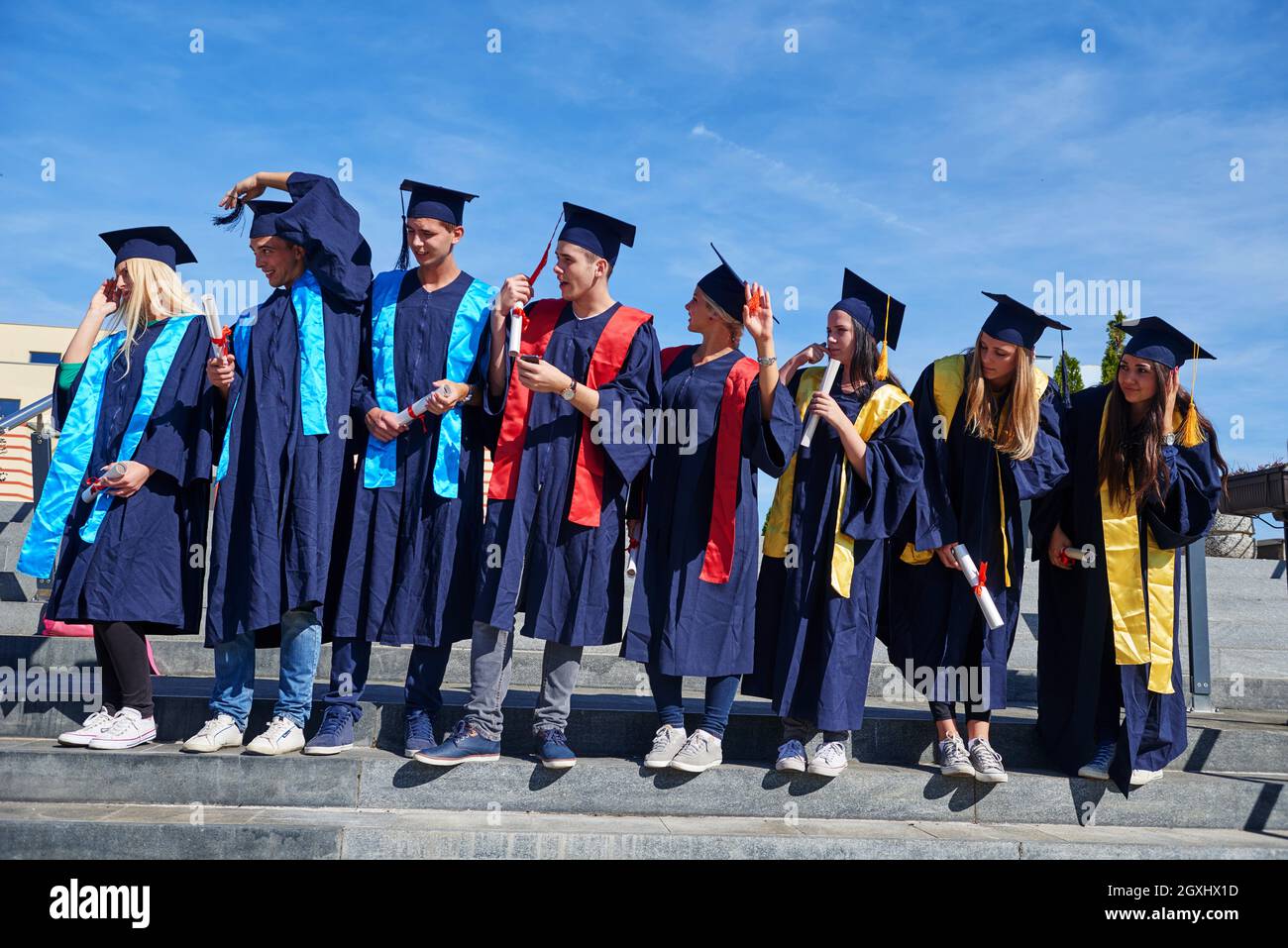 young graduates students group standing in front of university building ...