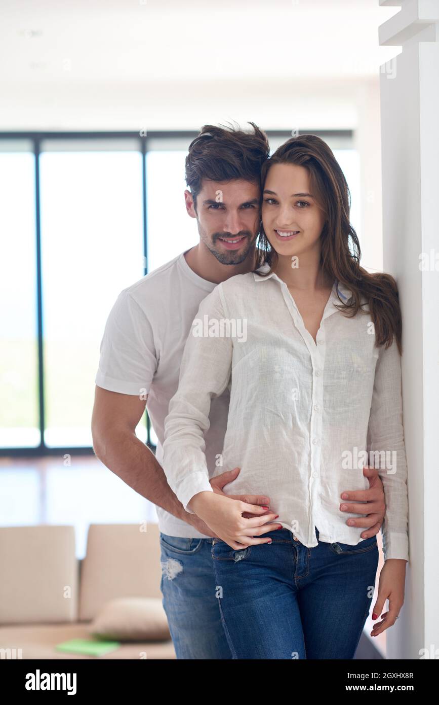 happy young romantic couple have fun relax smile at modern home outdoor ...