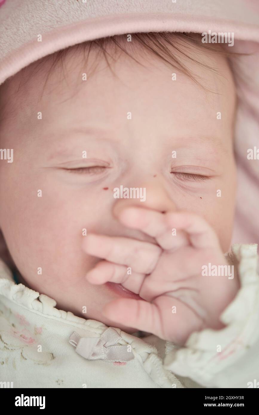 newborn baby girl sleeping in bed at home Stock Photo - Alamy