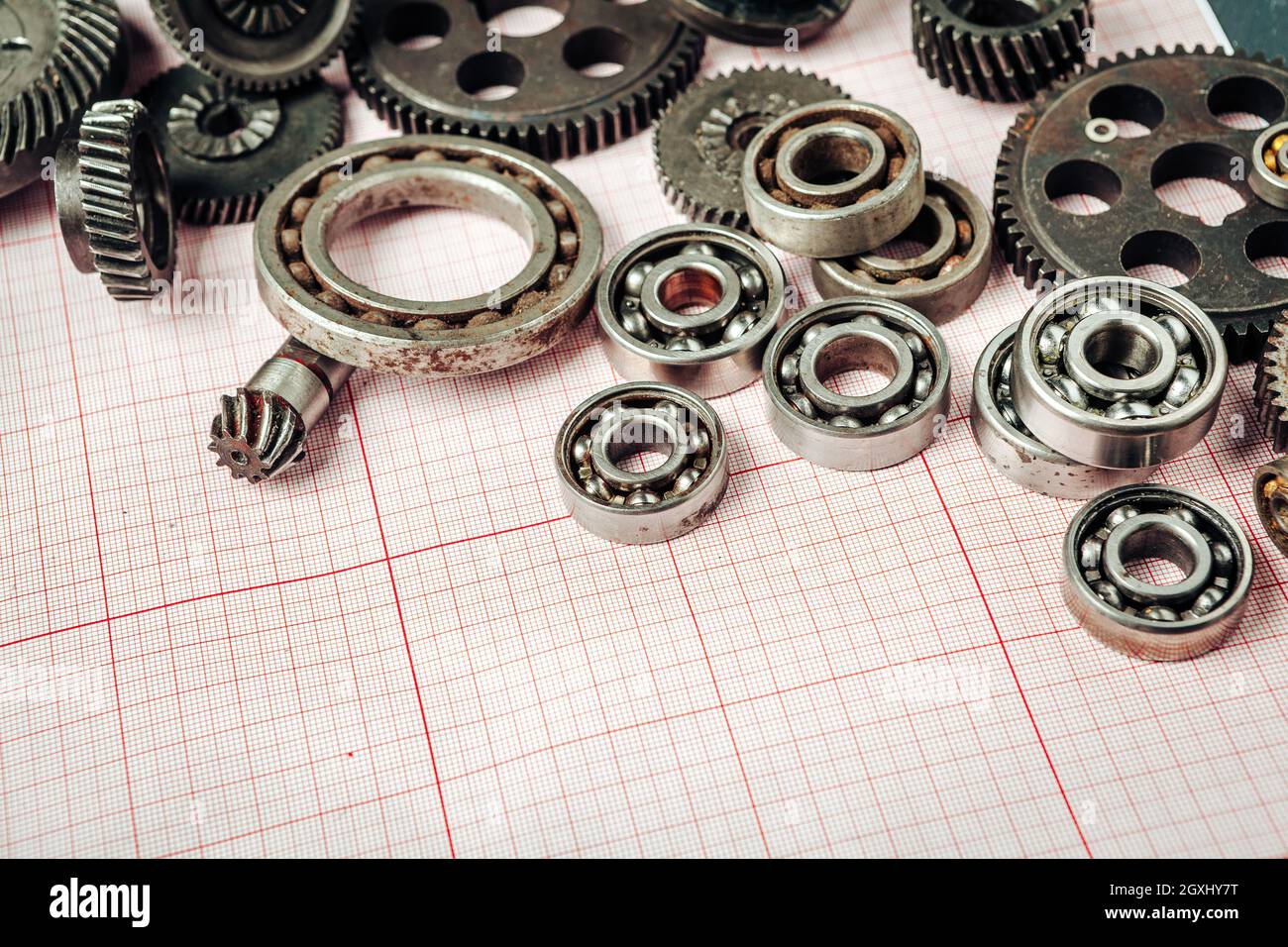 Car parts on graph paper close up. Engineering concept Stock Photo - Alamy