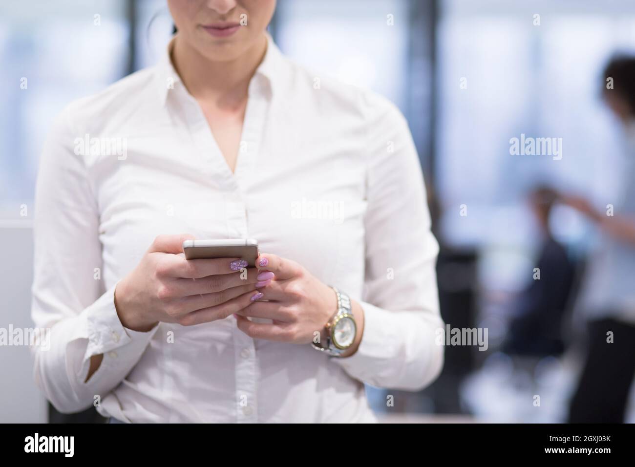 female manager using cell telephone in startup office interior Stock ...