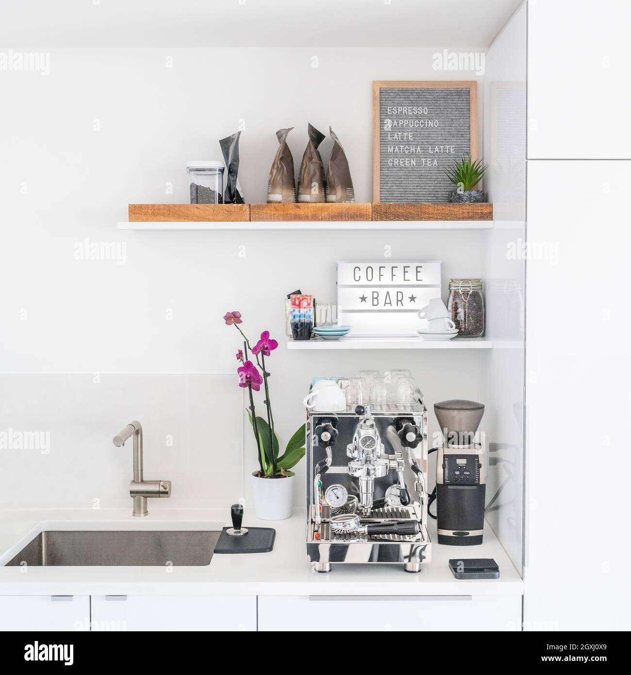 Luxury modern white kitchen with professional barista espresso machine ...