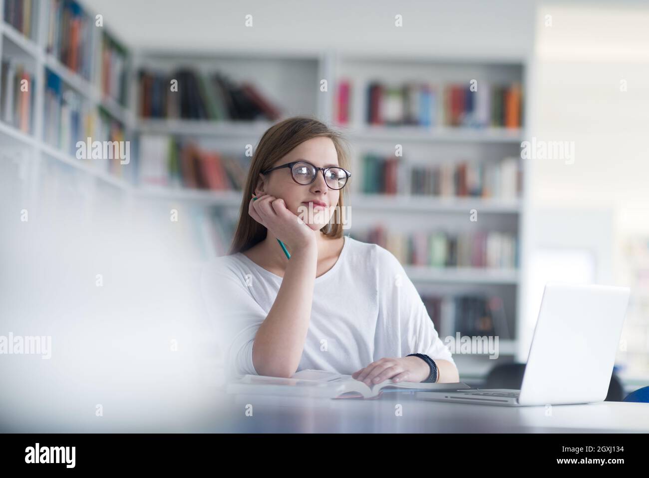 female student study in school library, using laptop and searching for ...