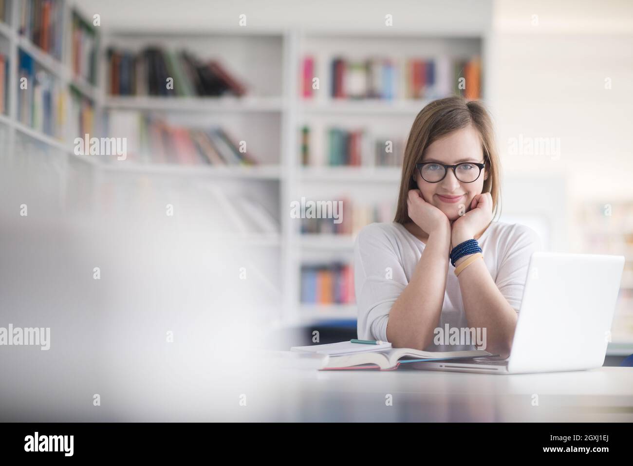 female student study in school library, using laptop and searching for ...