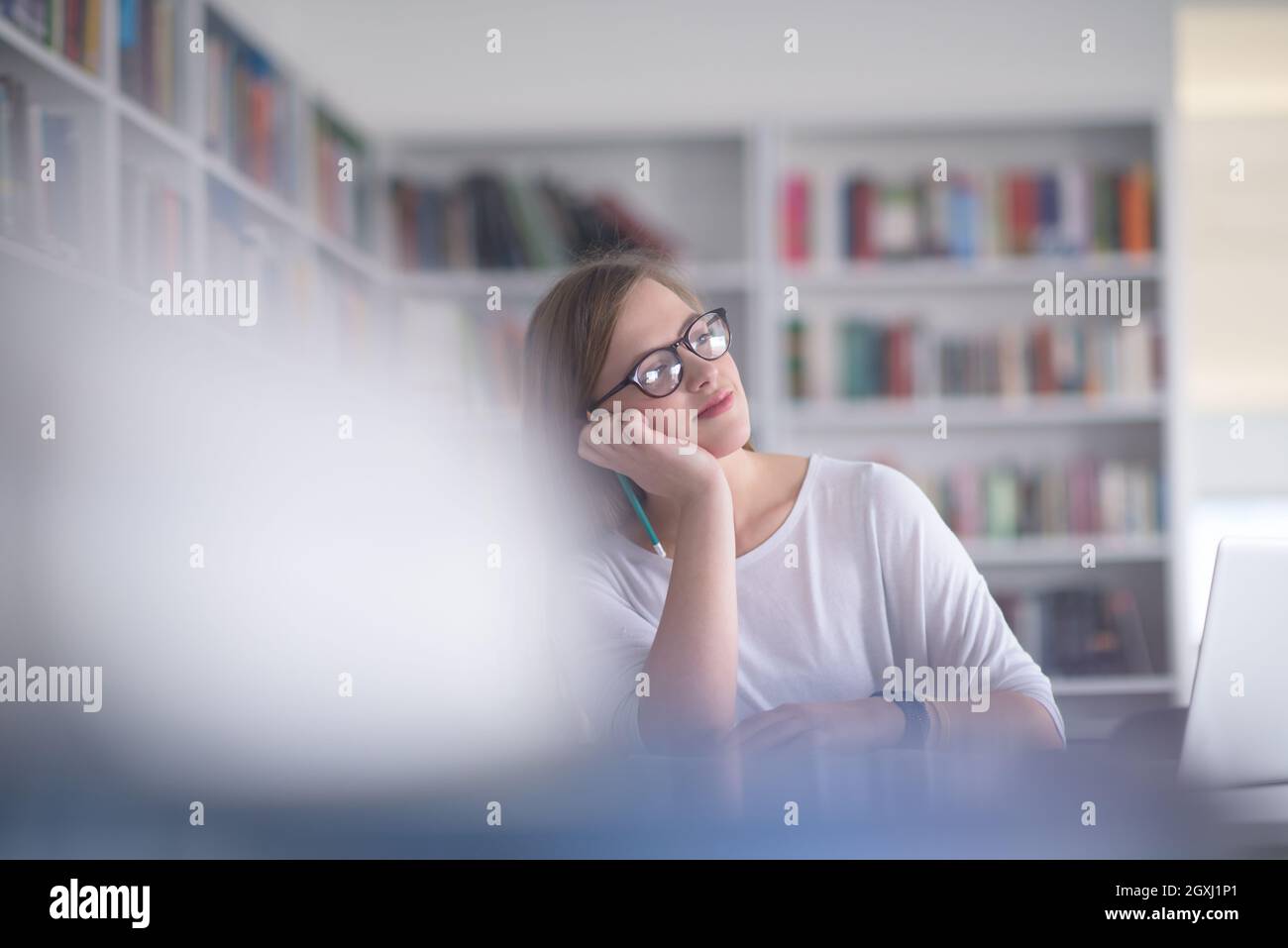 female student study in school library, using laptop and searching for ...