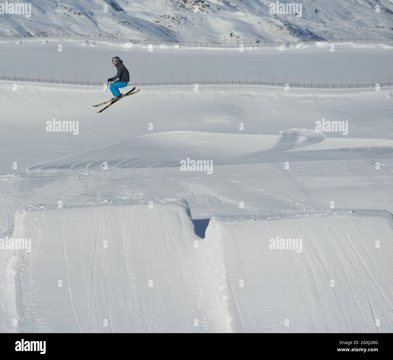 jumping skier at mountain winter snow fresh suny day Stock Photo - Alamy
