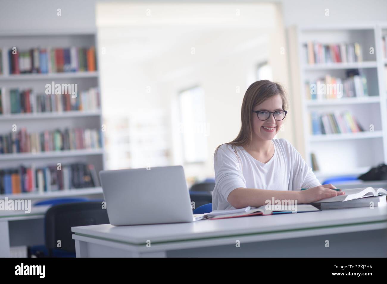 female student study in school library, using laptop and searching for ...