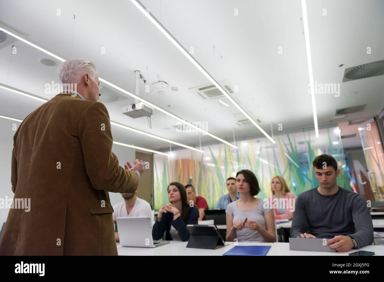 group of students study with professor in modern school classroom Stock ...