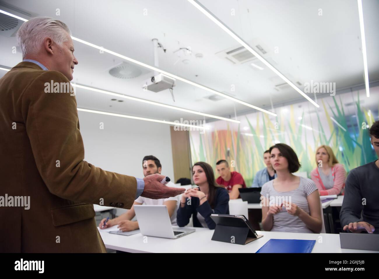 group of students study with professor in modern school classroom Stock ...