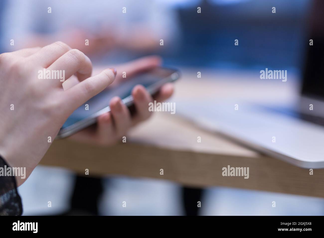 female manager using cell telephone in startup office interior Stock ...