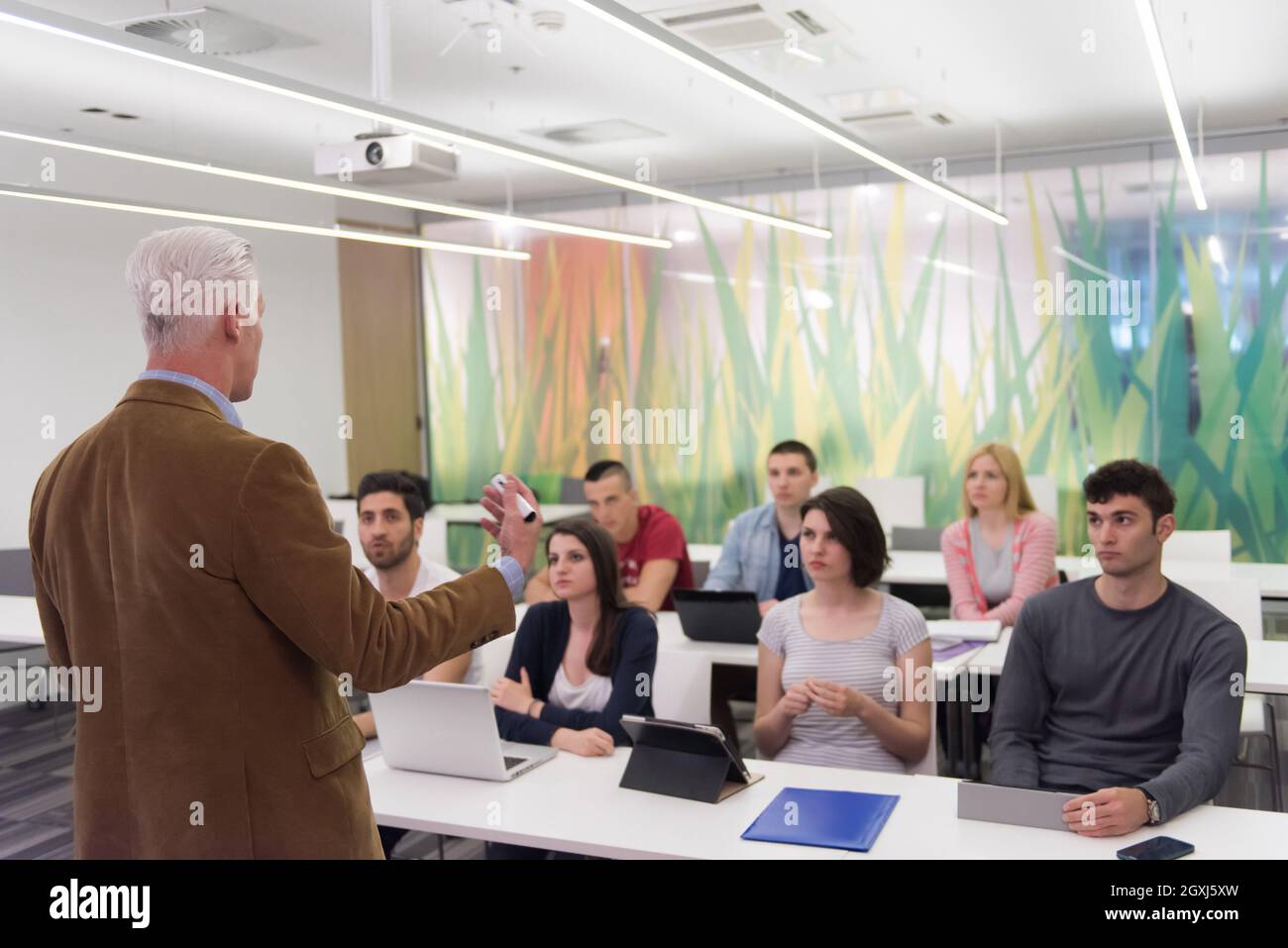 group of students study with professor in modern school classroom Stock ...