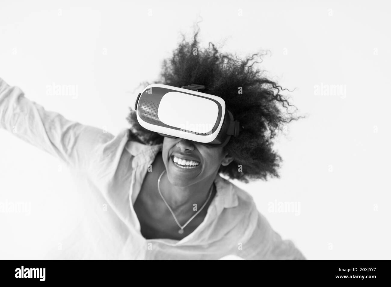Happy african american girl getting experience using VR headset glasses ...
