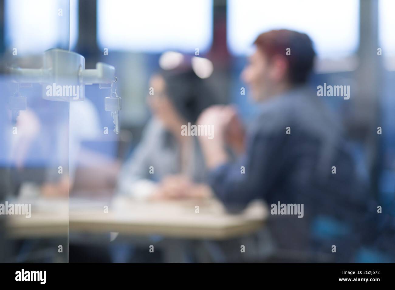 Open glass door with keys, key in keyhole Stock Photo - Alamy