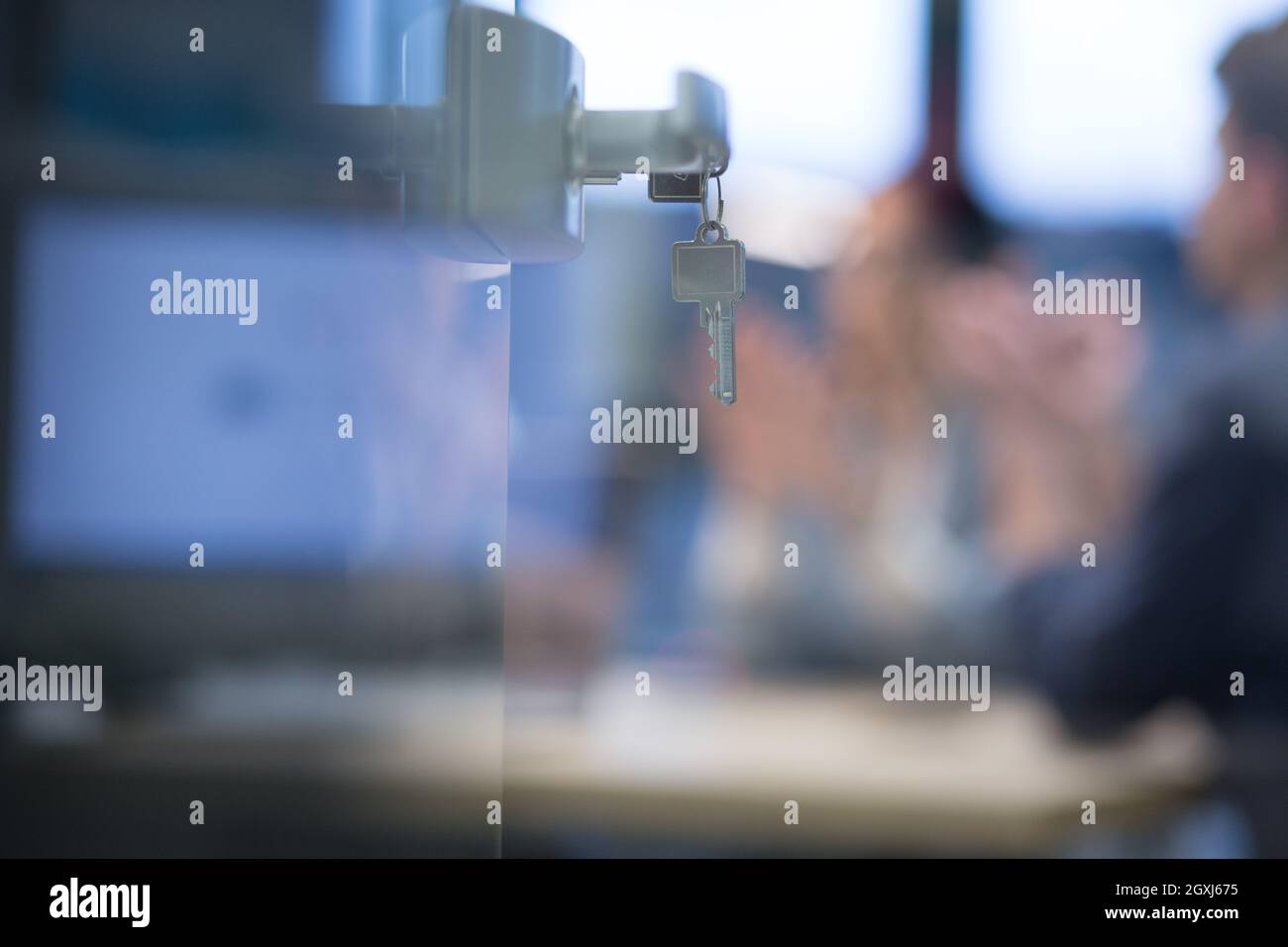 Open glass door with keys, key in keyhole Stock Photo - Alamy