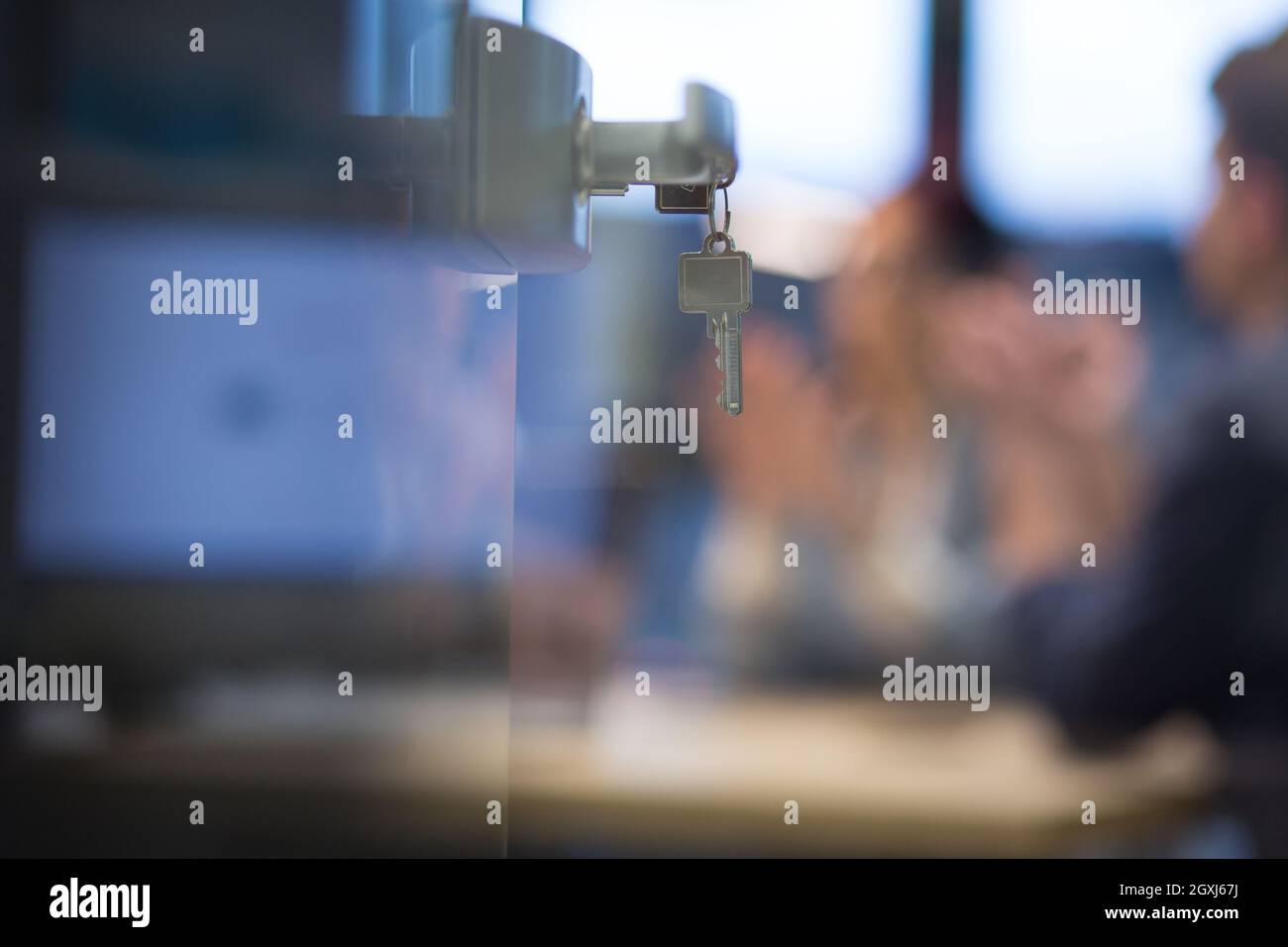 Open glass door with keys, key in keyhole Stock Photo - Alamy