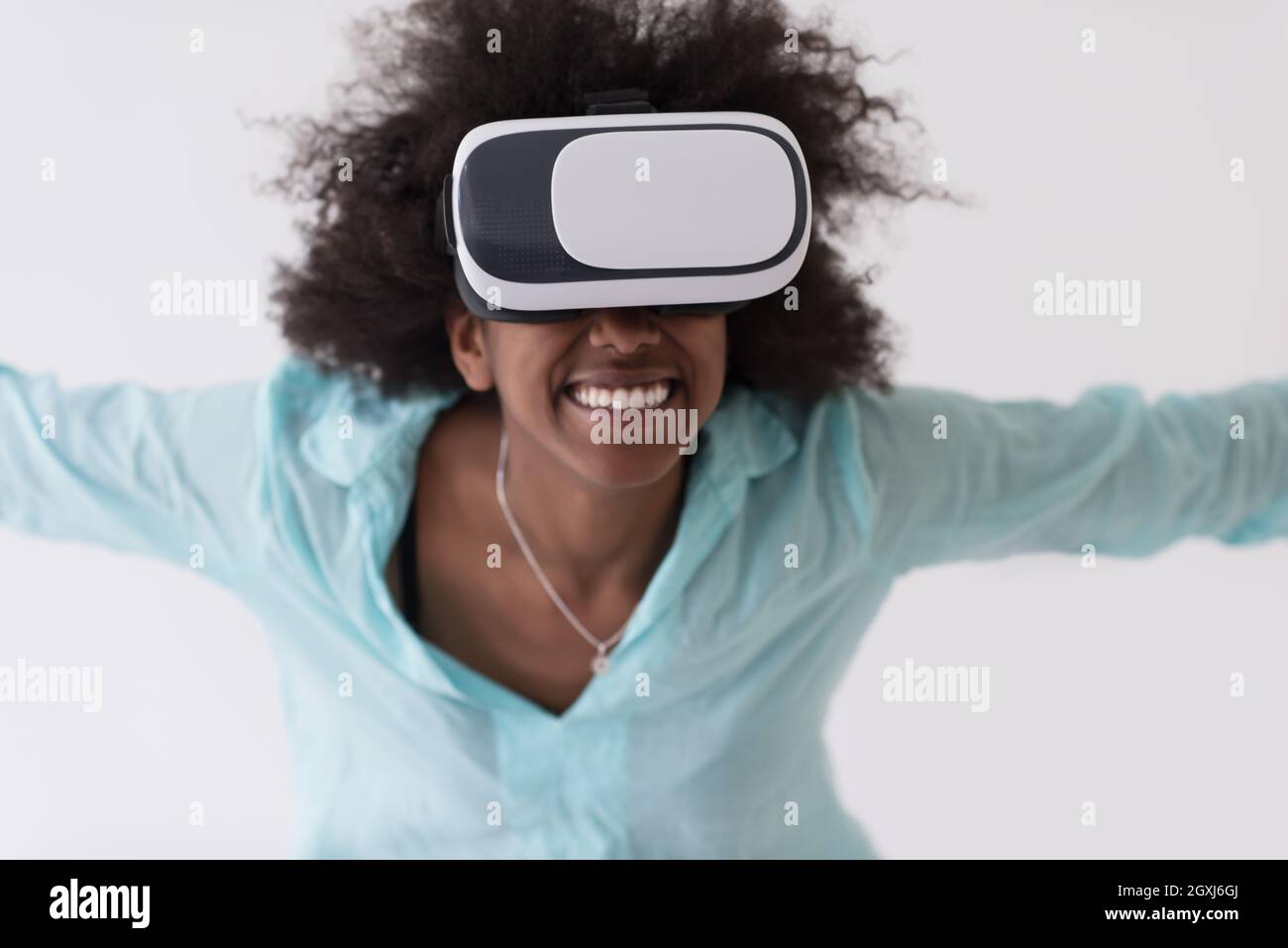 Happy african american girl getting experience using VR headset glasses ...