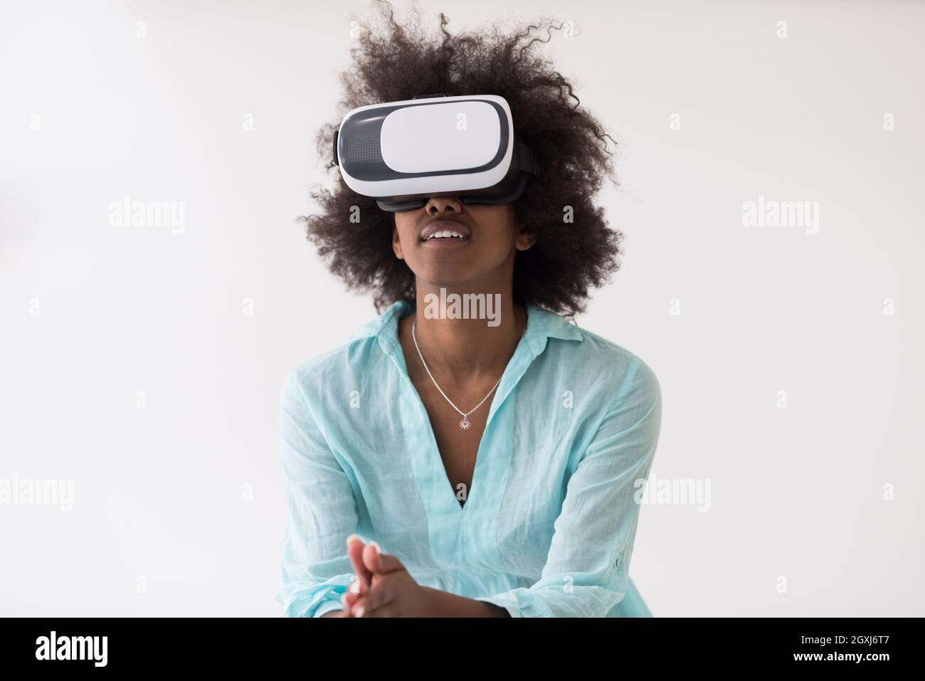 Happy african american girl getting experience using VR headset glasses ...