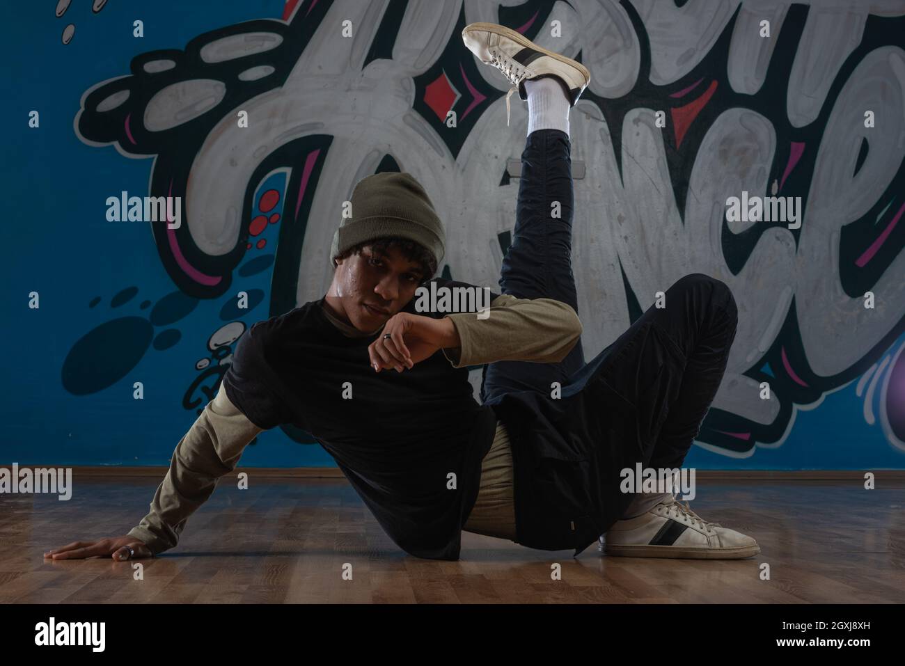 Modern rapper dancing in garage. Urban lifestyle, hip hop Stock Photo ...