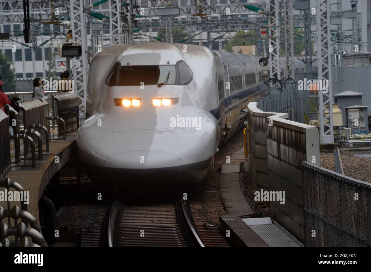 Rapid train Shinkansen arrives in a station, Ushimado, Japan Stock ...
