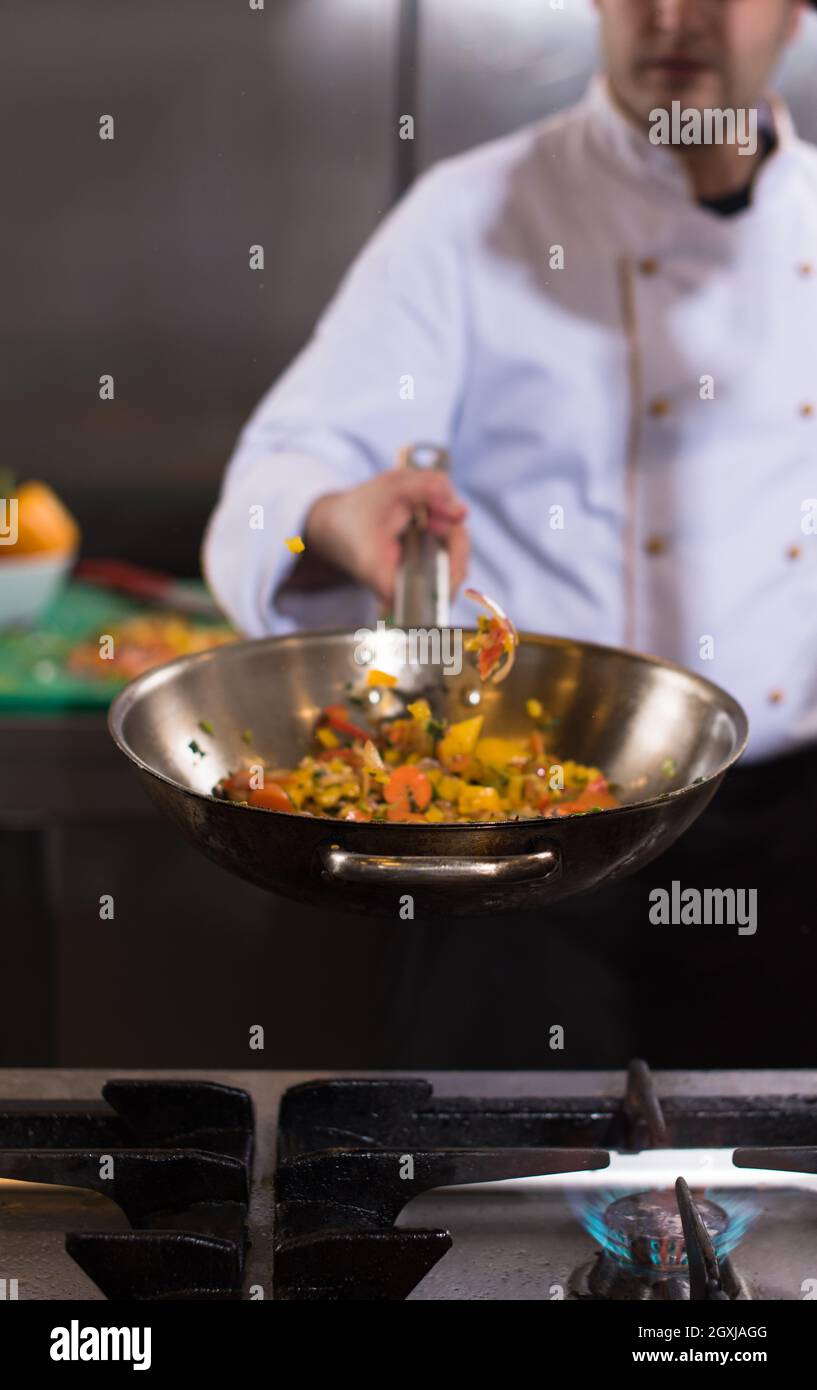 Flipping in wok hi-res stock photography and images - Alamy