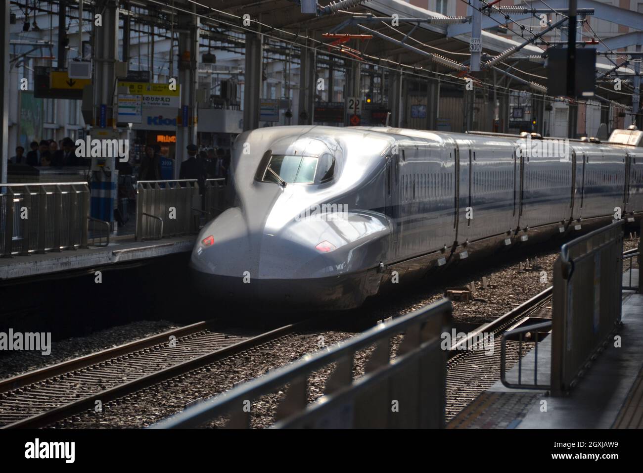 Rapid speed rail train Shinkansen arrives on a platform, Ushimado ...