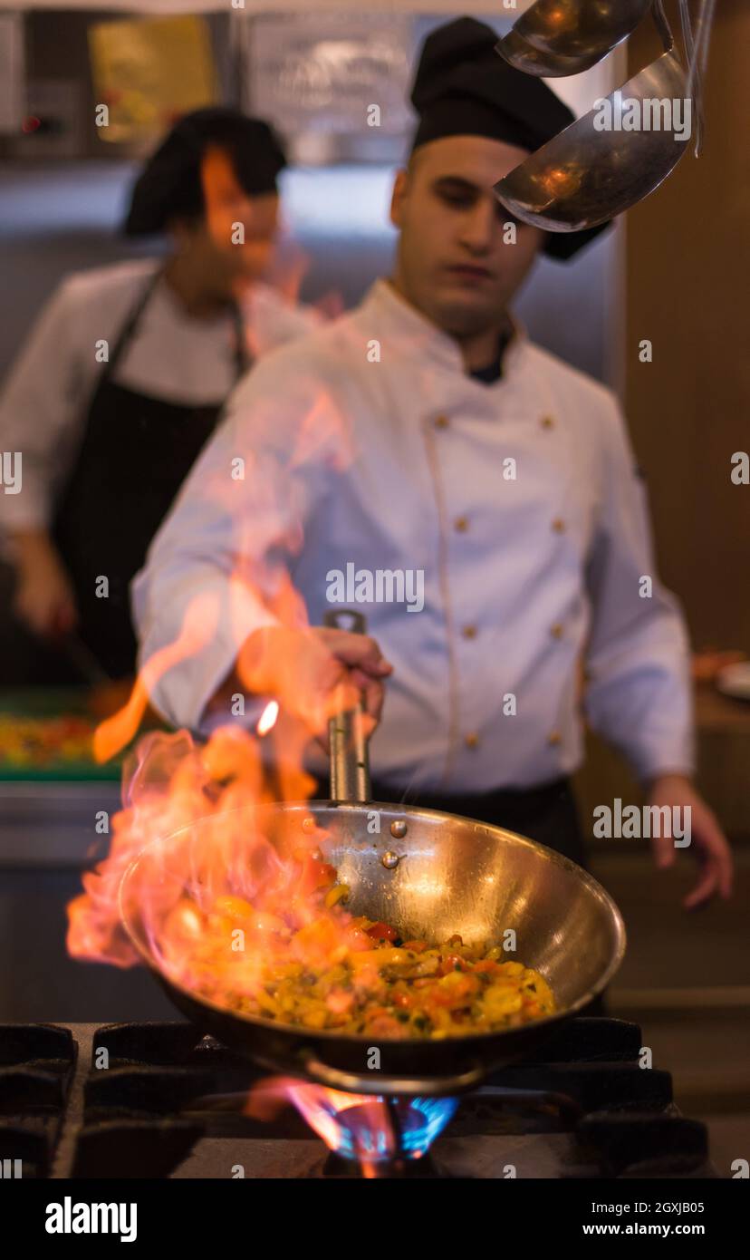 Chef working flaming pan hi-res stock photography and images - Alamy