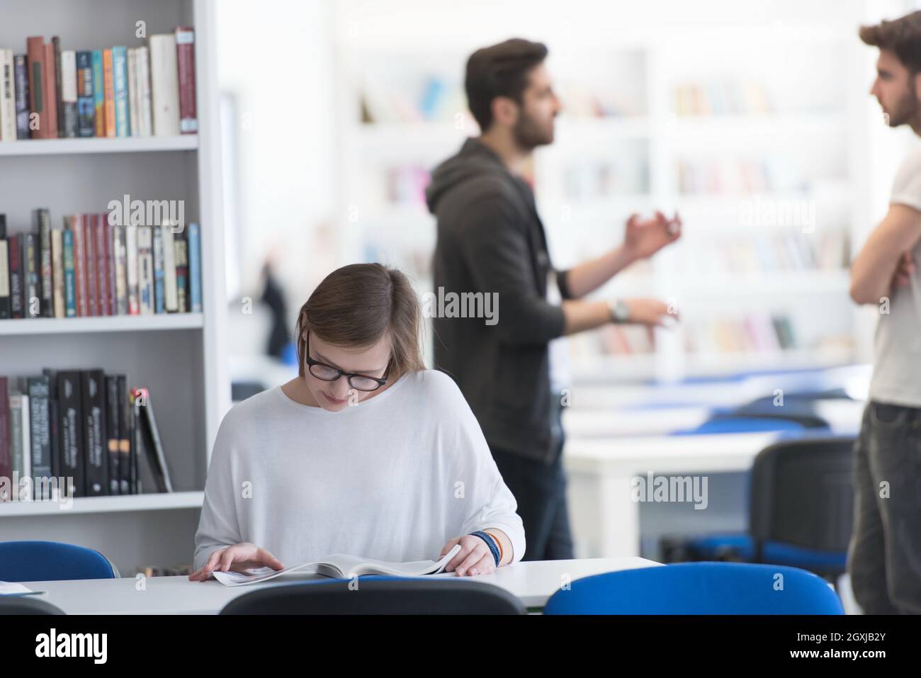 female smart looking student study in school library, group of students ...