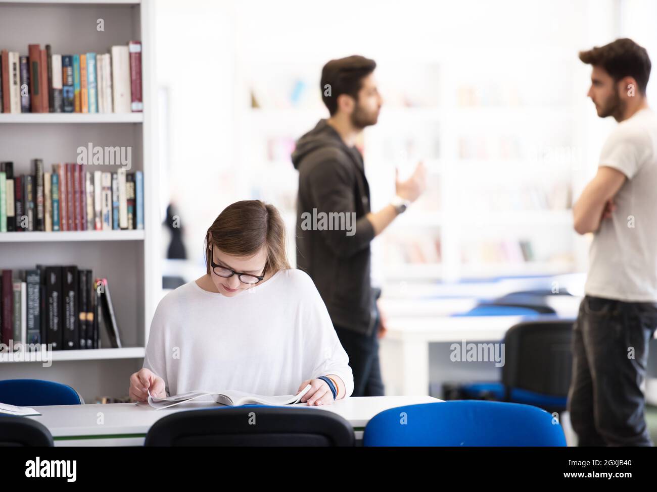 female smart looking student study in school library, group of students ...