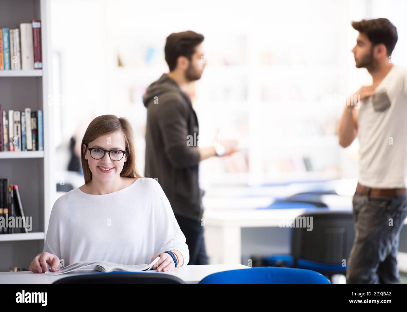 female smart looking student study in school library, group of students ...