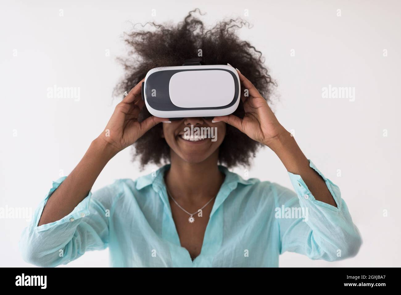 Happy african american girl getting experience using VR headset glasses ...