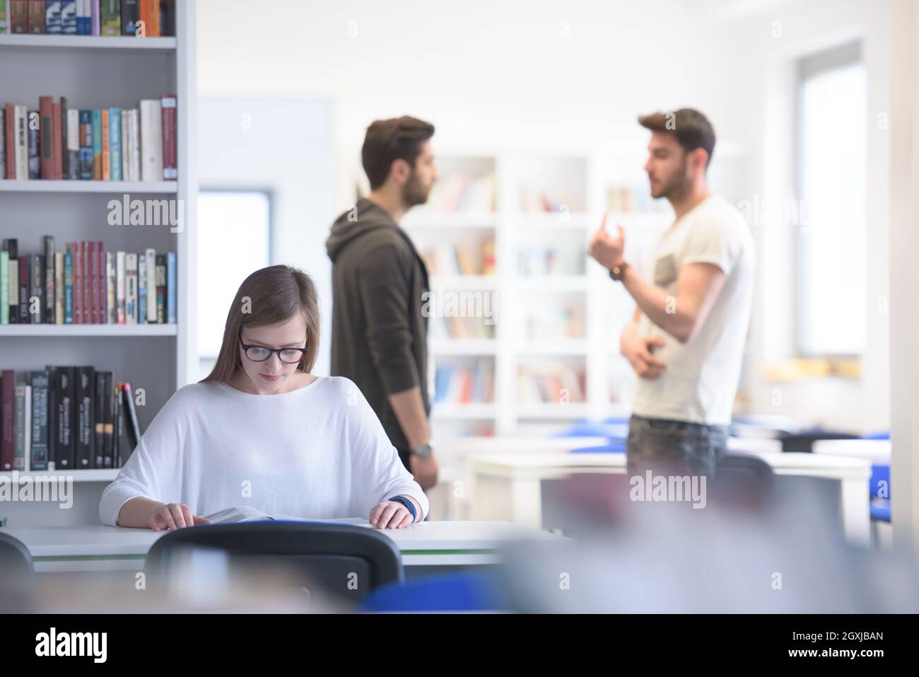 female smart looking student study in school library, group of students ...