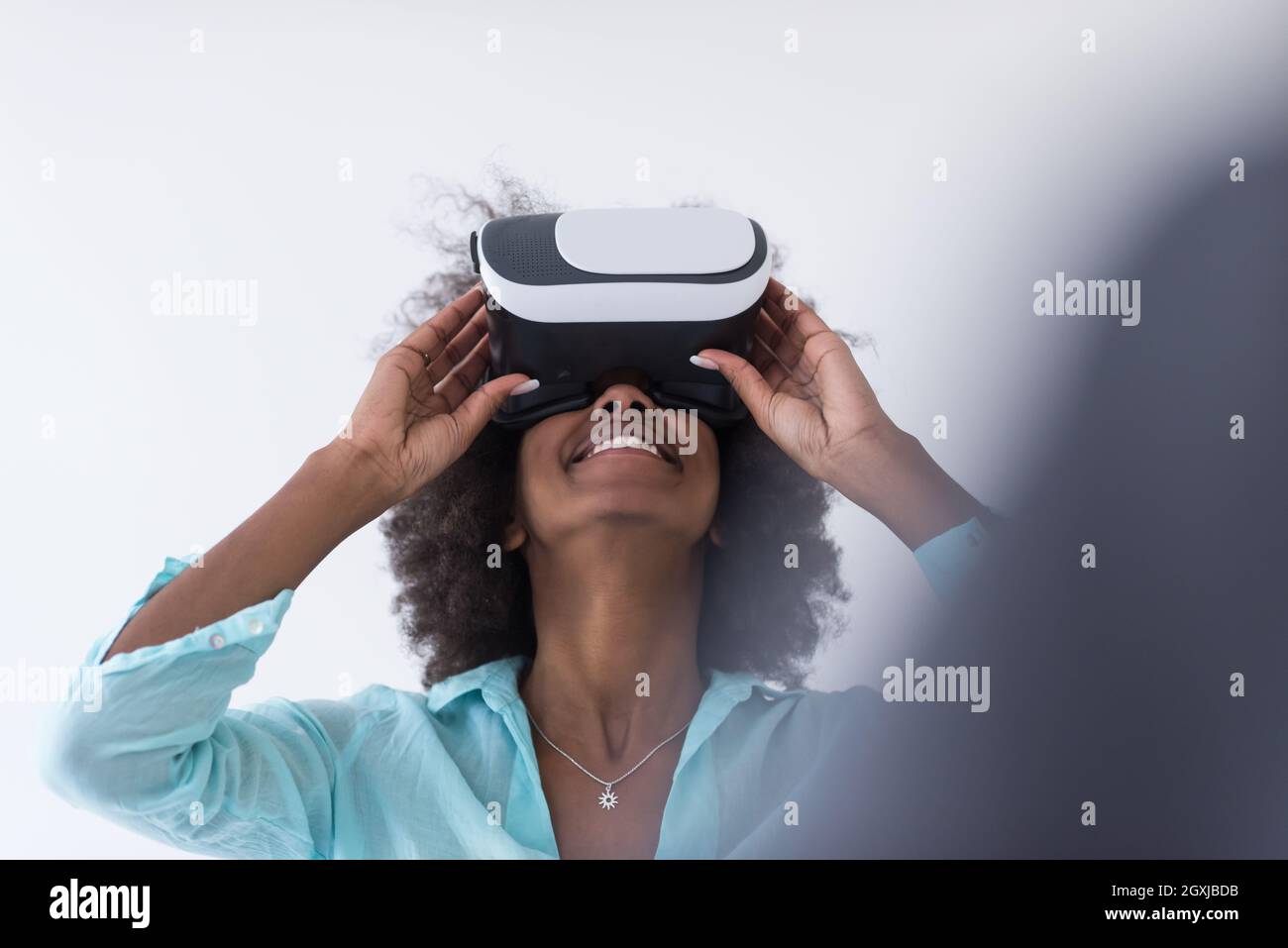 Happy african american girl getting experience using VR headset glasses ...