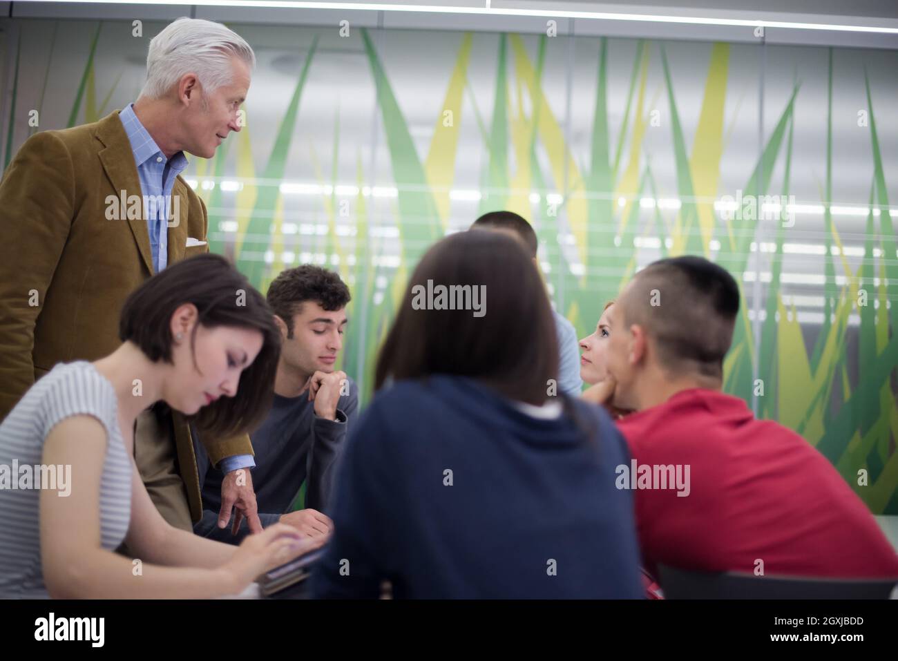 group of students study with professor in modern school classroom Stock ...