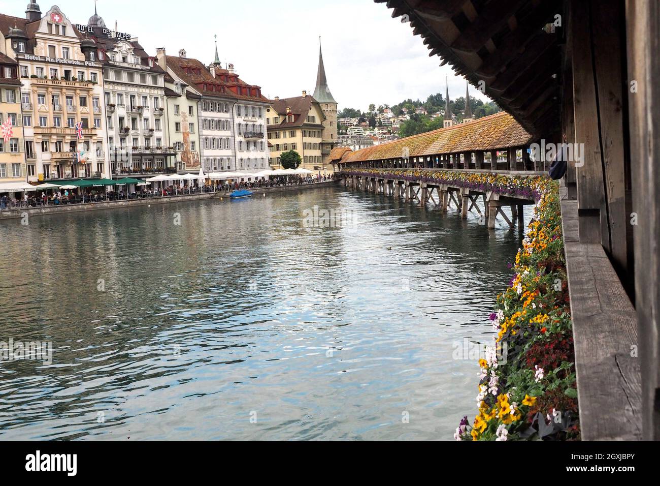The historic Chapel Bridge with water tower on the River Reuss ...