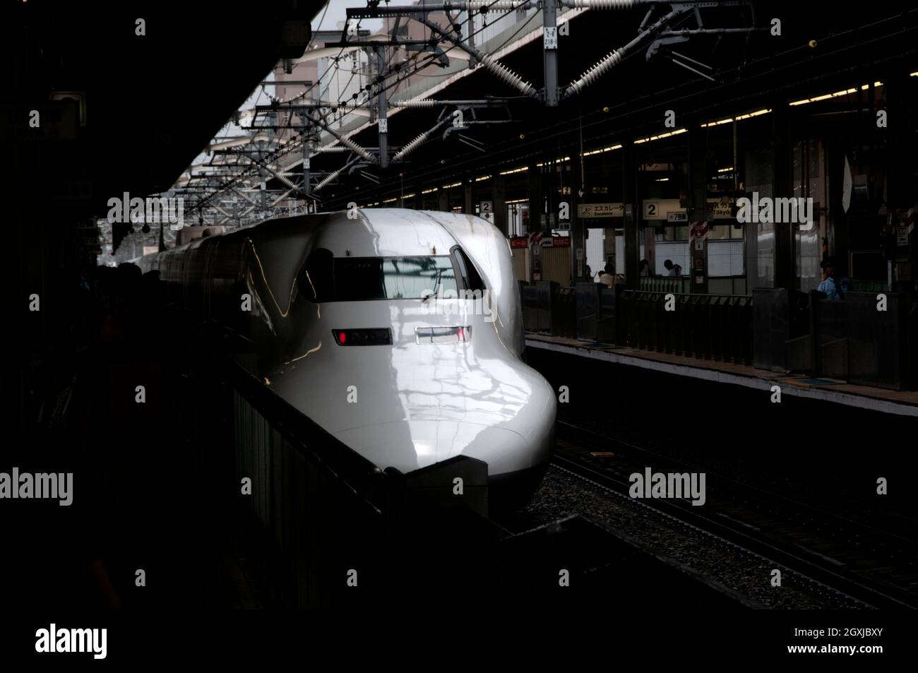 High-speed Shinkansen bullet train arriving at the platform, Tokyo ...