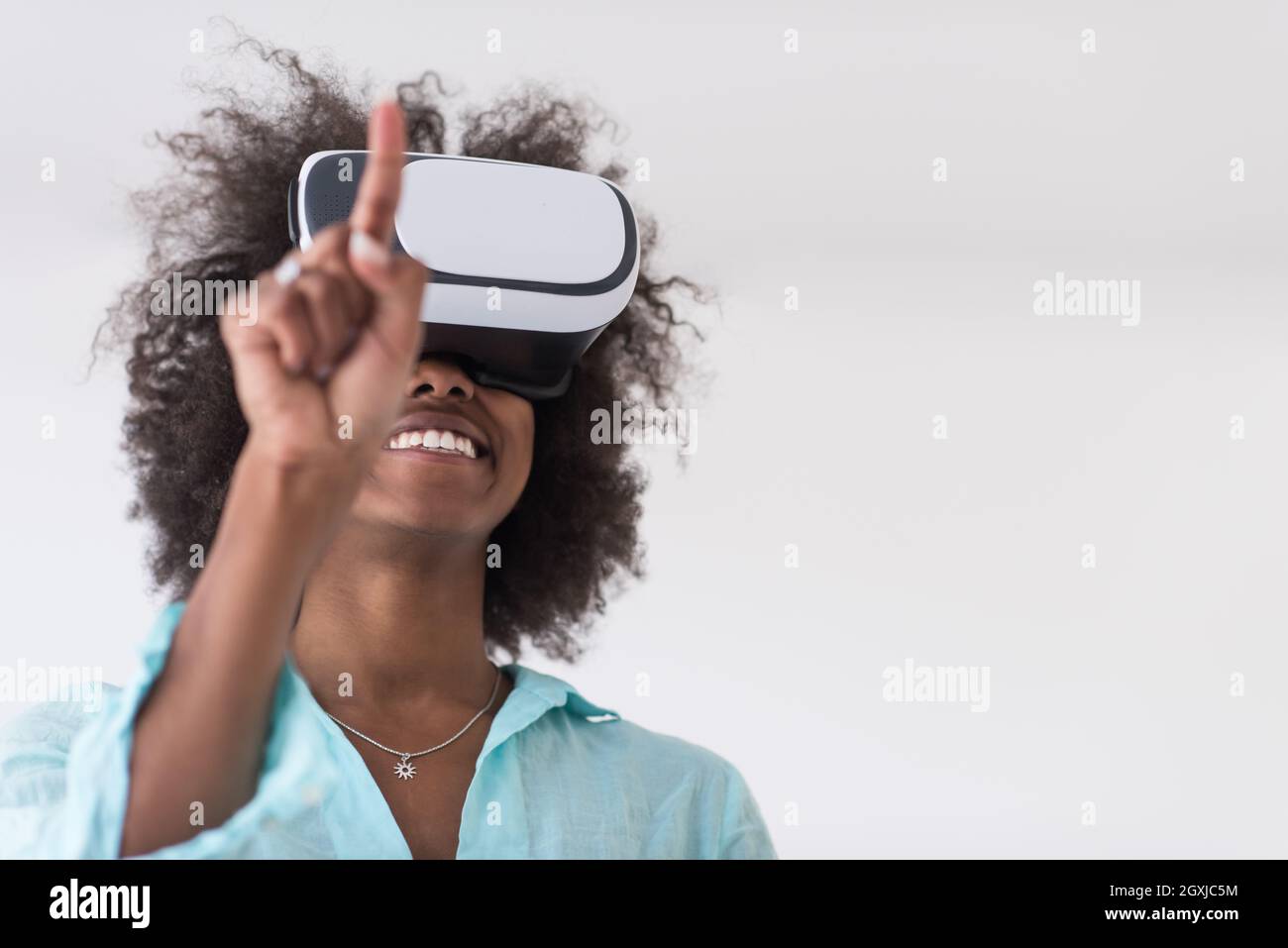 Happy african american girl getting experience using VR headset glasses ...