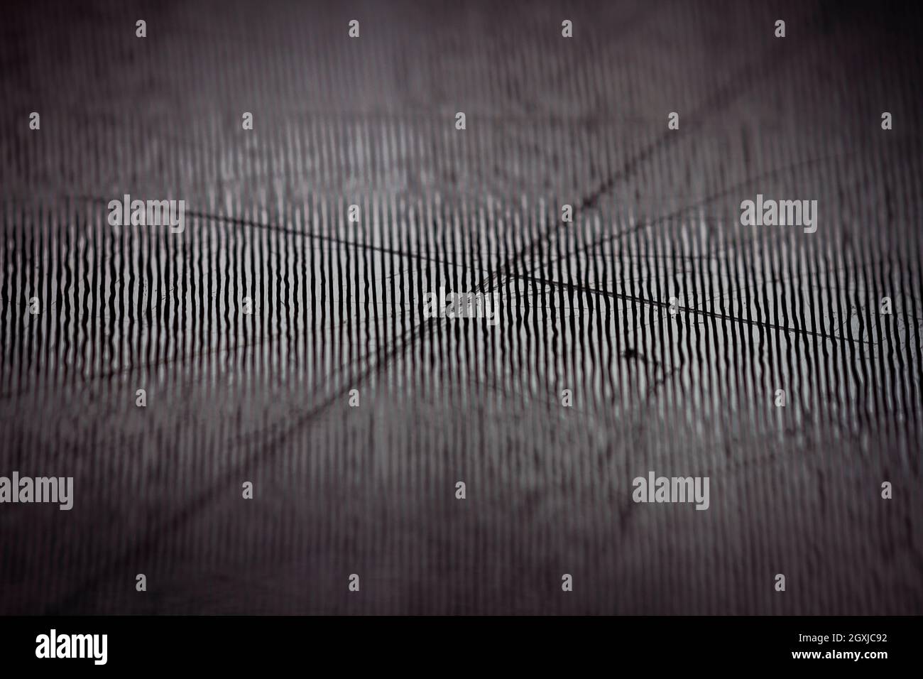 Macro shot of black vinyl record showing scratches. Surface of an old ...