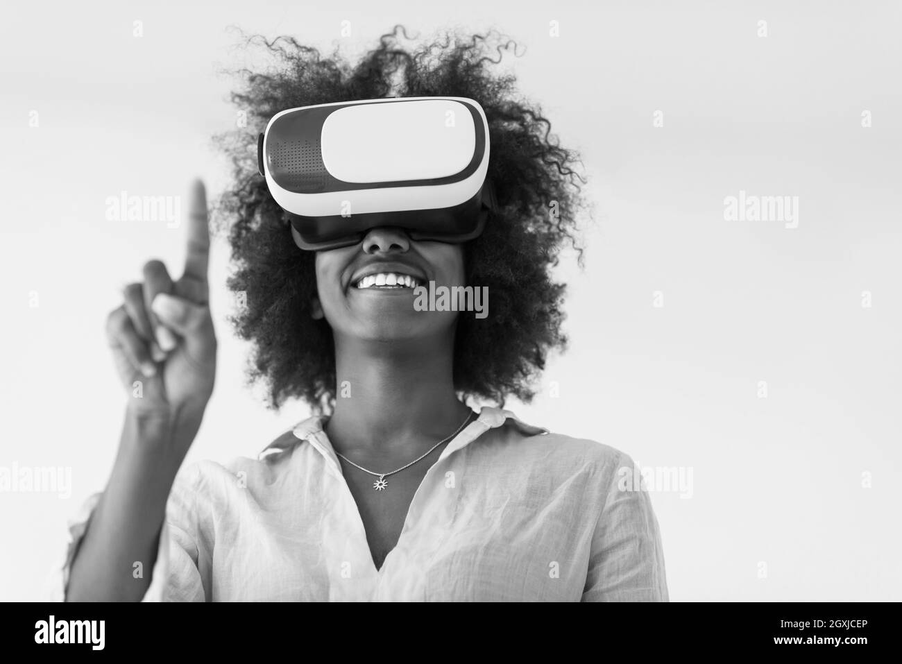 Happy african american girl getting experience using VR headset glasses ...
