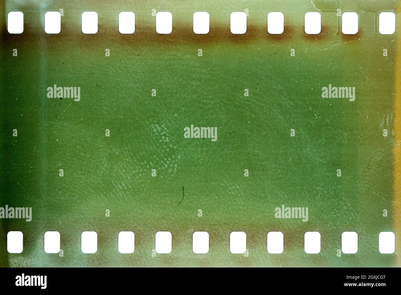 Dusty and grungy 35mm film texture or surface. Perforated camera film ...
